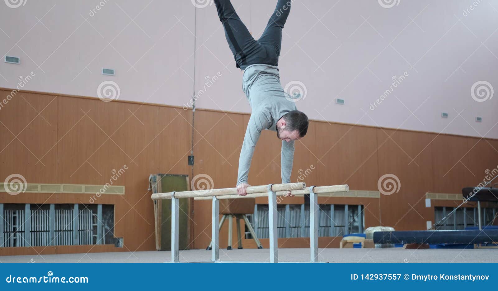 Gymnast Doing Handstand on Parallel Bars at Gym Stock Video - Video of ...