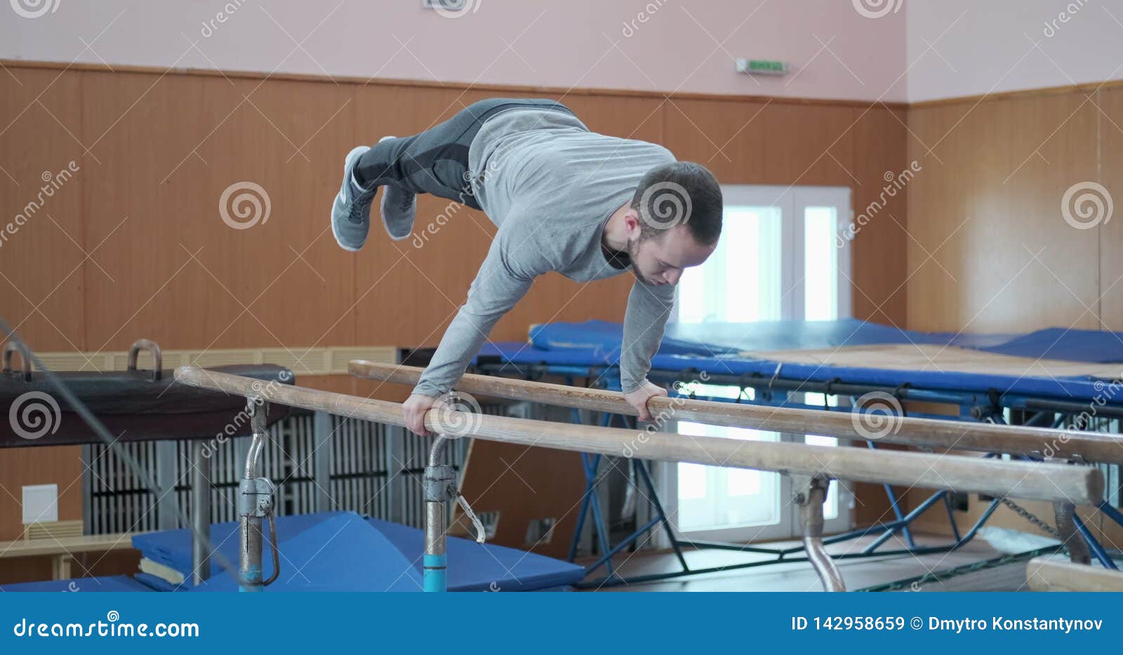 Gymnast Doing Planche Exercise on Parallel Bars Stock Video - Video of ...