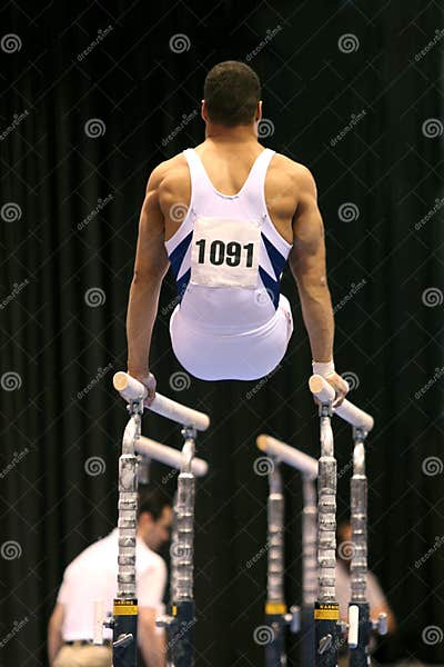 Gymnast on parallel bars stock image. Image of bicep, person - 121143
