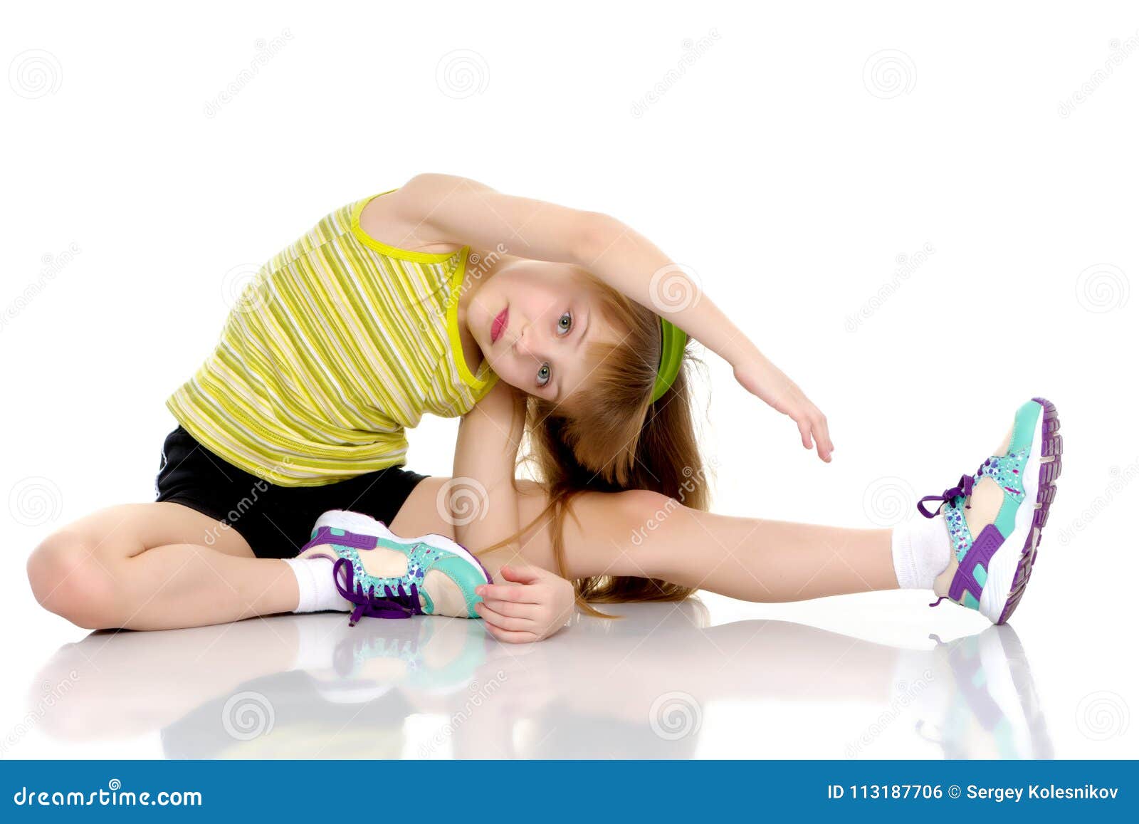 The Gymnast Perform an Acrobatic Element on the Floor. Stock Photo ...