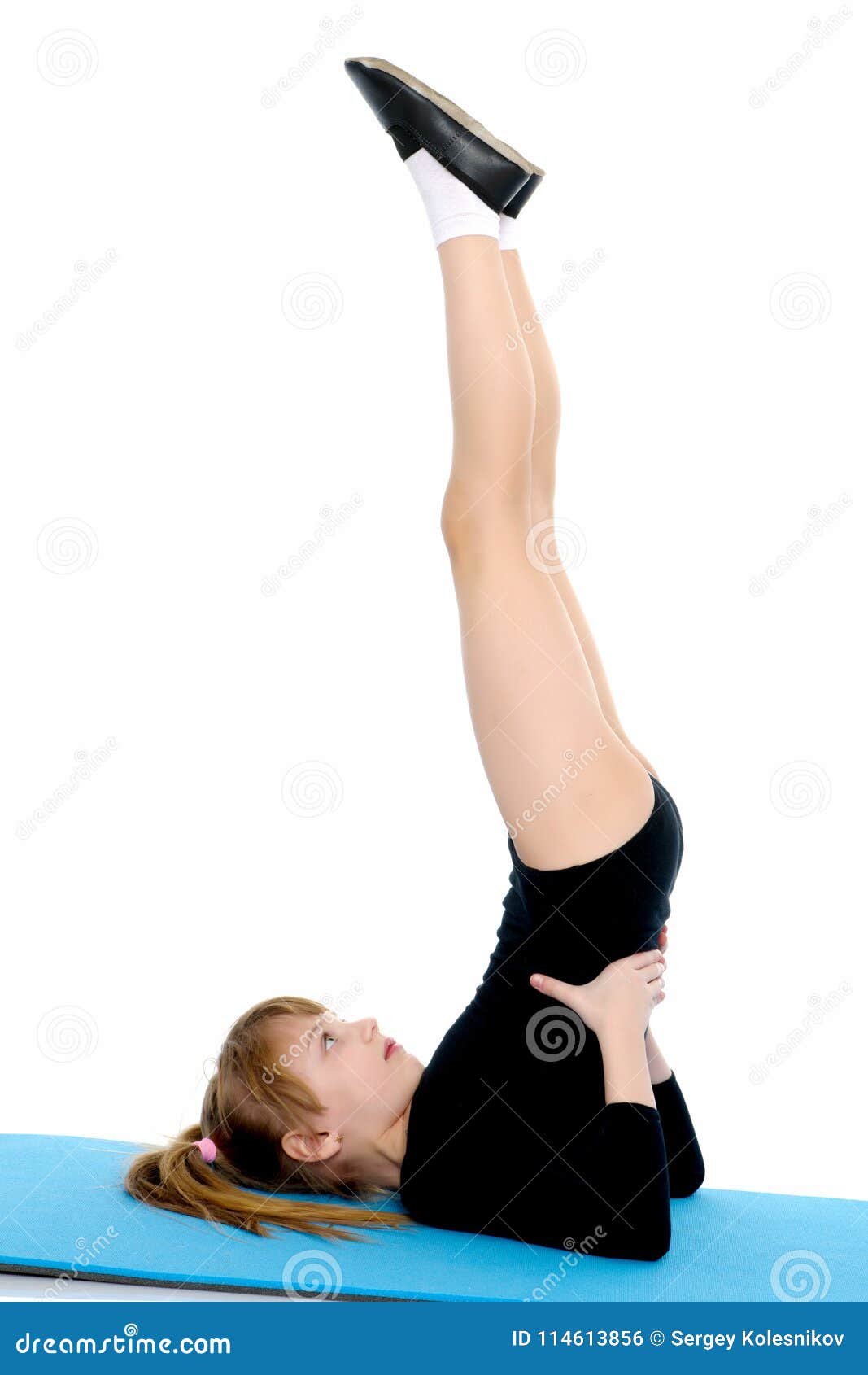 The Gymnast Perform an Acrobatic Element on the Floor. Stock Photo ...
