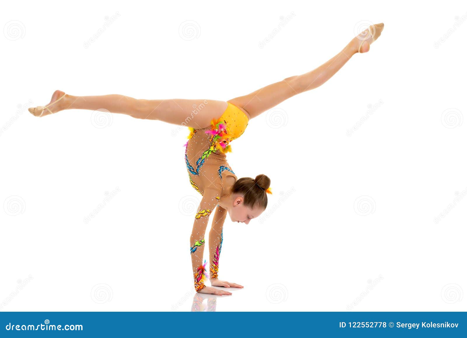 The Gymnast Perform an Acrobatic Element on the Floor. Stock Photo ...