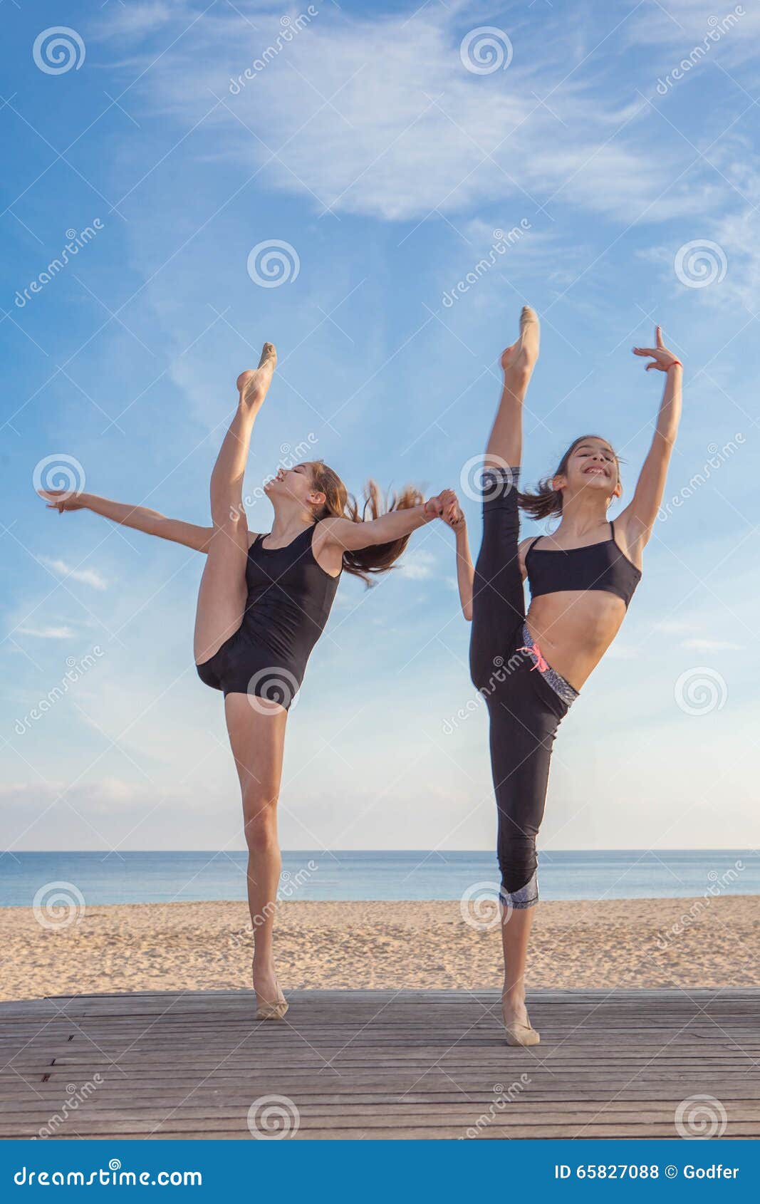 Gymnasts exercising pose stock photo. Image of exercising - 65827088
