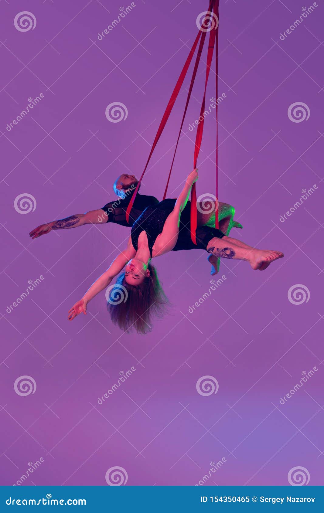 Beautiful Girl and an Athletic Man in a Black Sport Suits are ...