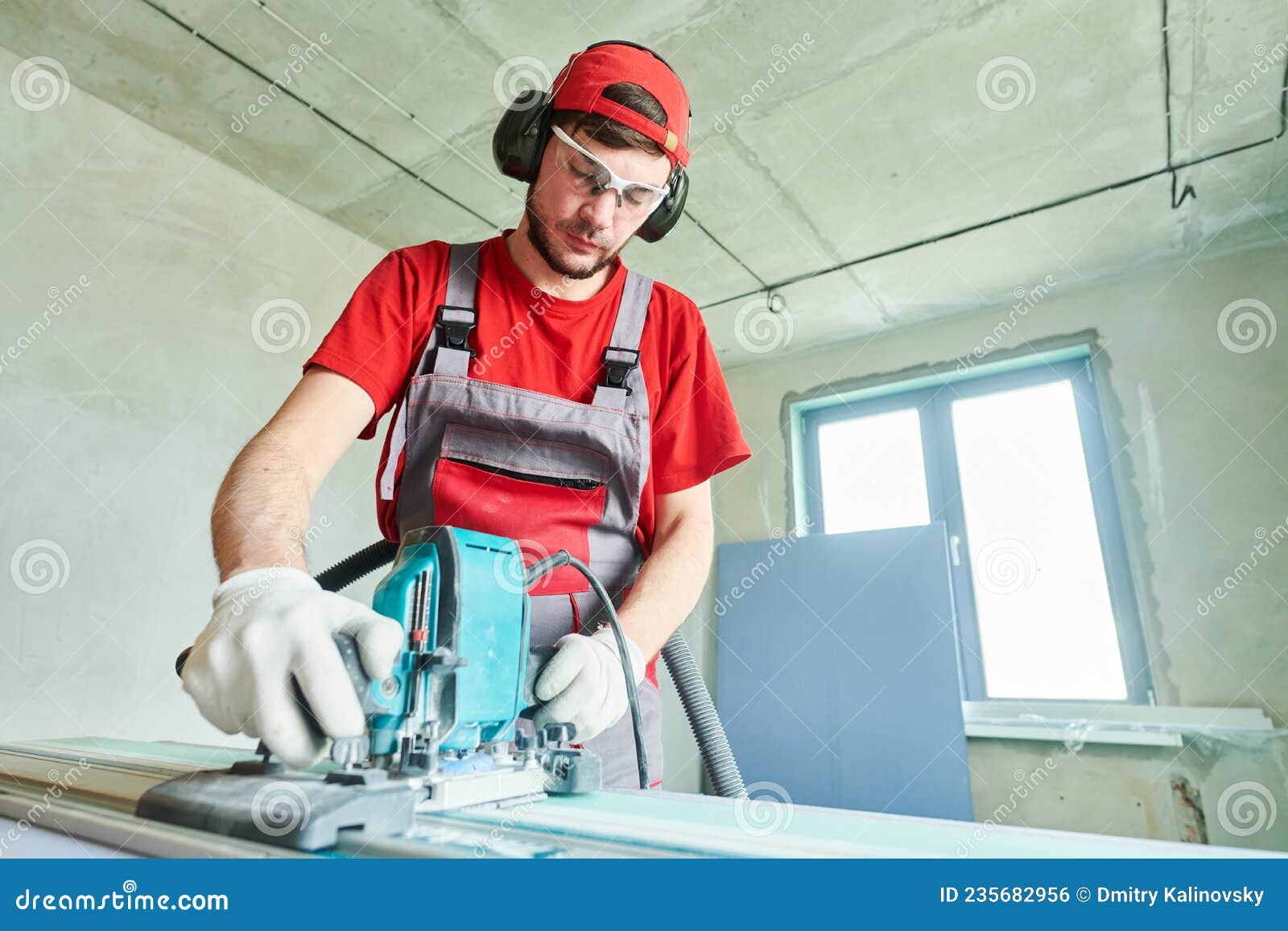 Drywall Construction at Home. Contractor Worker Milling Gypsum ...