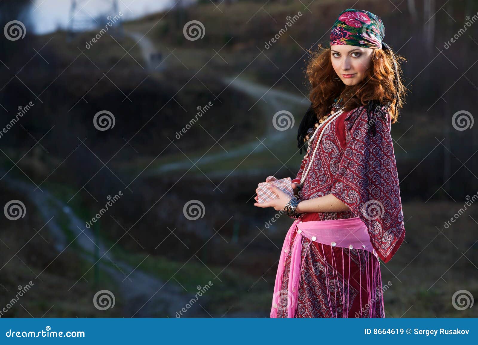 Gypsy Woman Barefoot With Long Black Hair Dances In A Red Dress On A ...