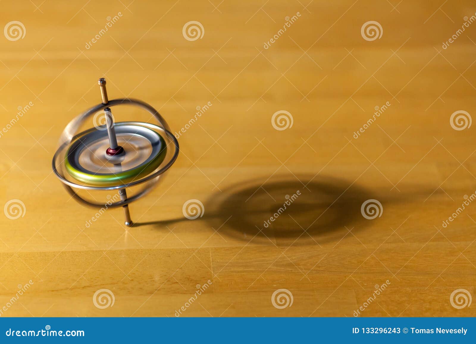 Gyroscope Spinning and Balancing on a Wooden Table Stock Image - Image ...