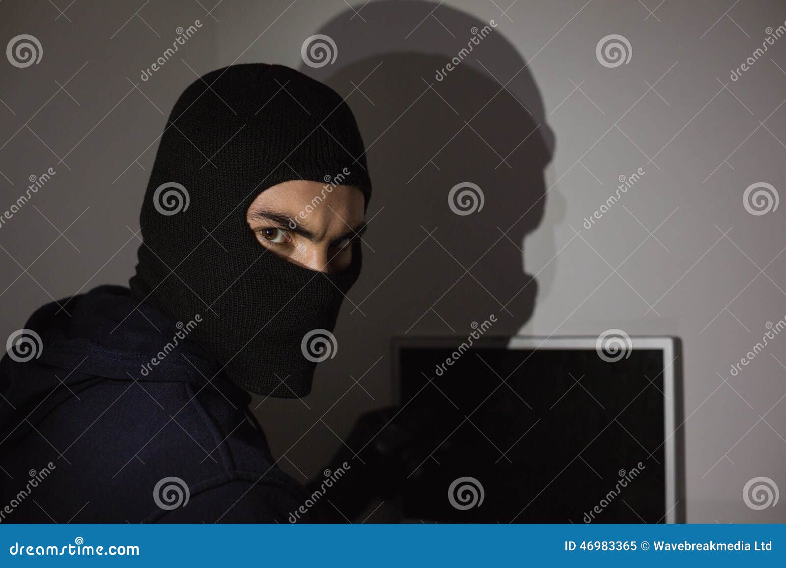 Hacker in Balaclava Hacking Laptop while Looking at Camera Stock Image ...