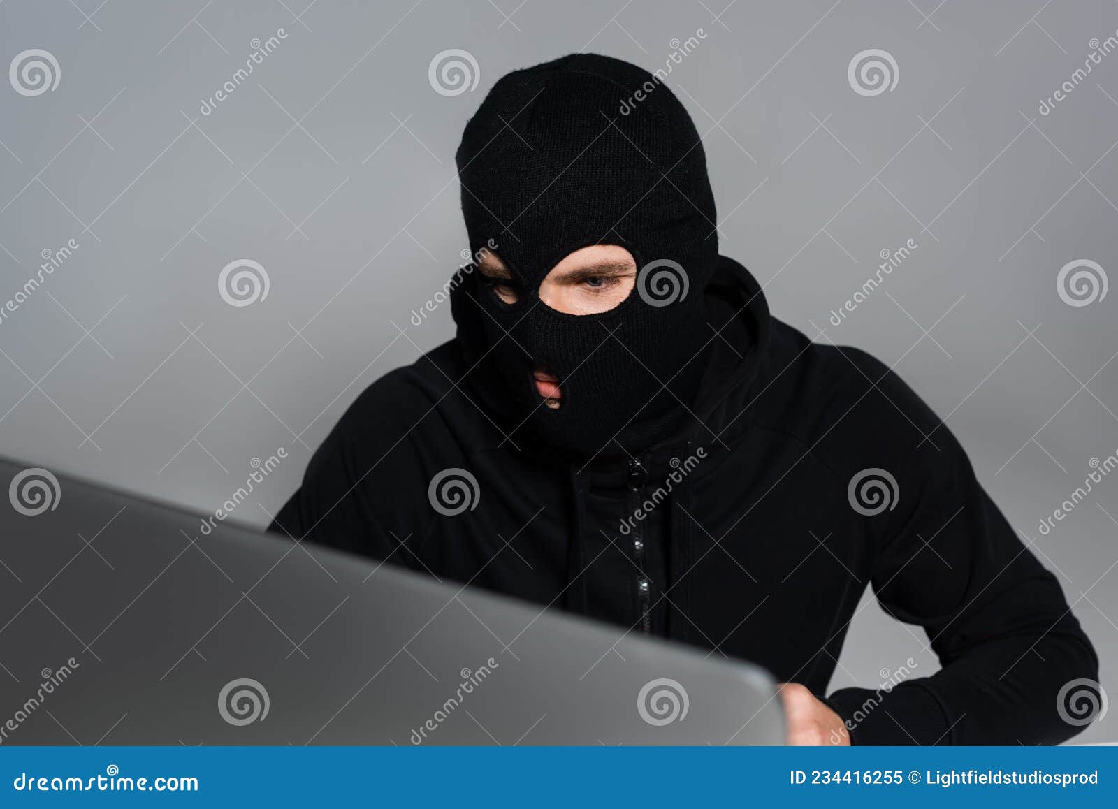 Hacker in Balaclava Looking at Computer Stock Image - Image of ...