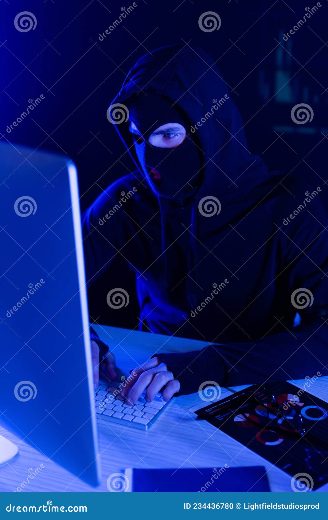 Hacker in Balaclava Using Computer Near Stock Photo - Image of dark ...