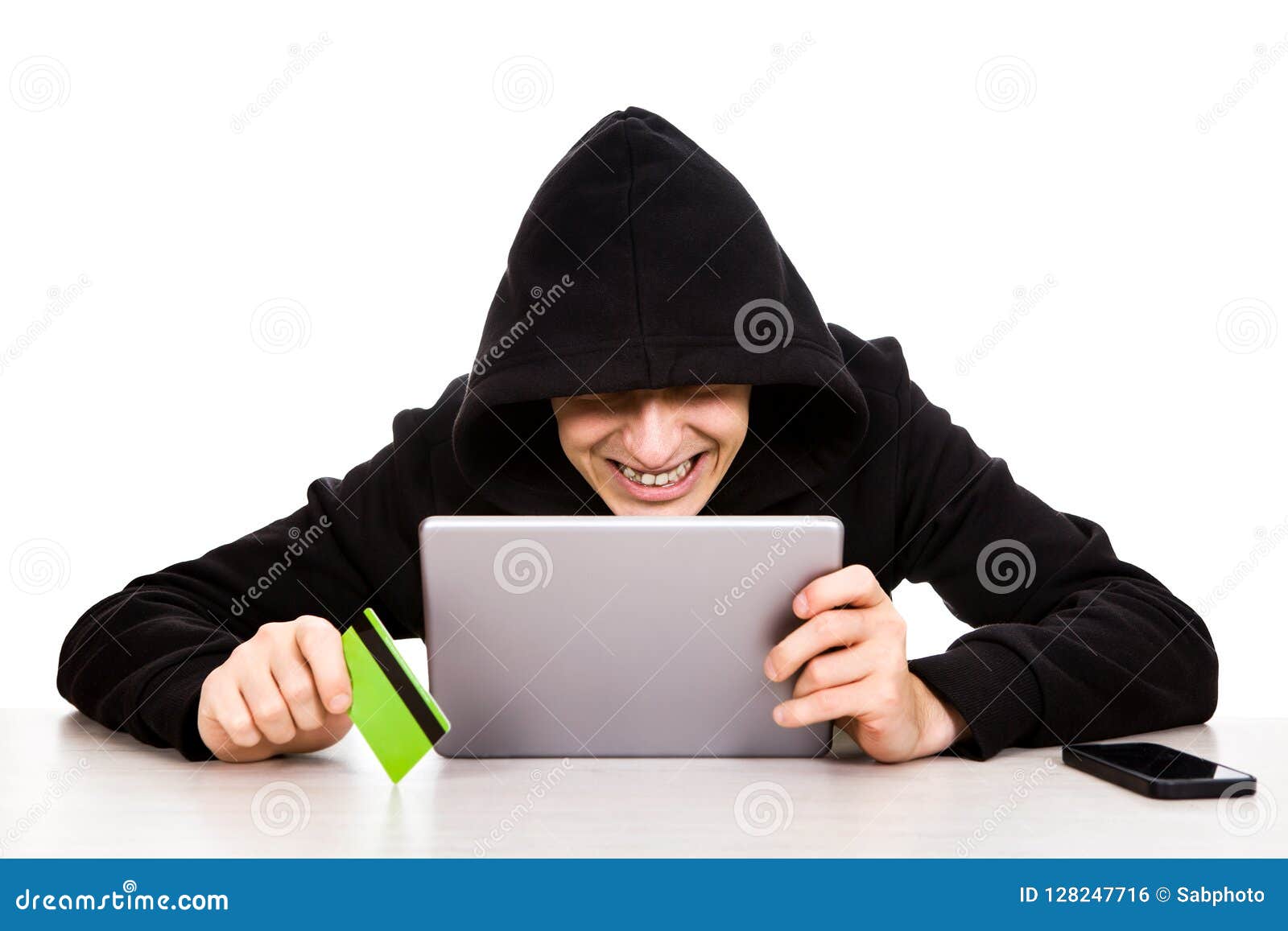 Hacker with a Bank Card stock photo. Image of hoodie - 128247716