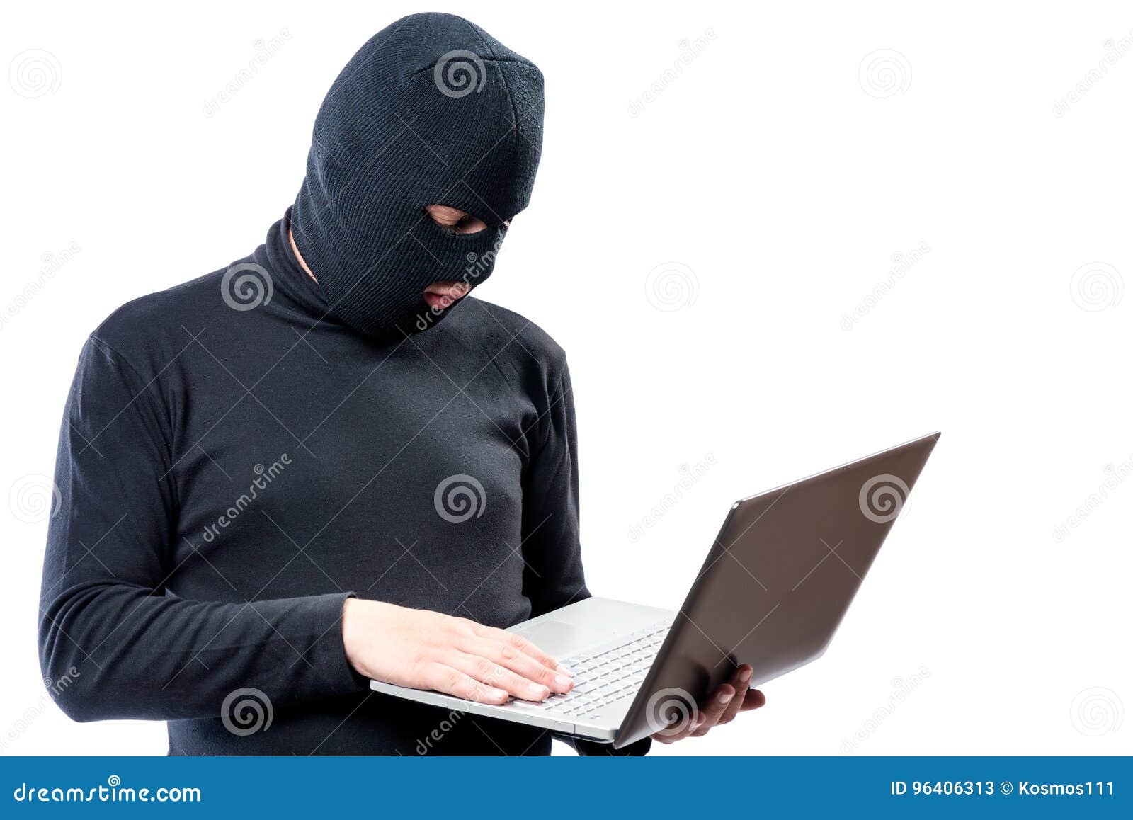 A Hacker In Black Clothes And A Mask With A Laptop On A White Royalty ... A Hacker In Black Clothes And A Mask With A Laptop On A White Royalty ...