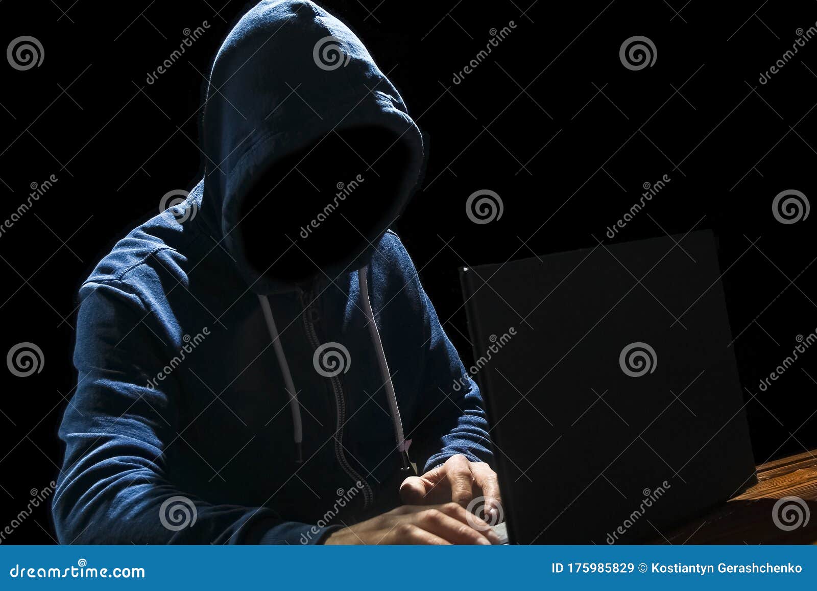 Hacker with Computer Man Sitting at a Table in a Hood Stock Image ...