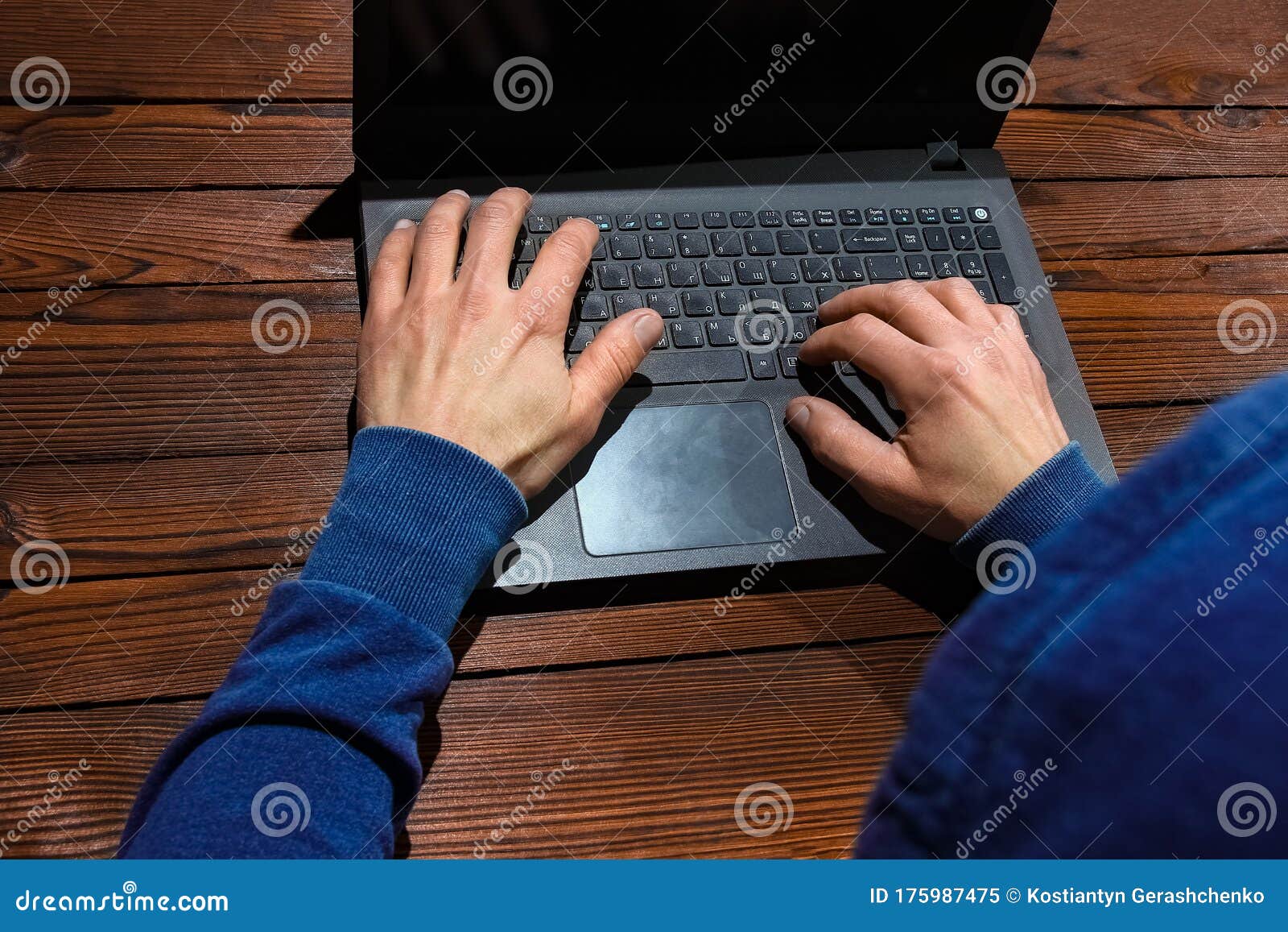 Hacker with Computer Man Sitting at a Table in a Hood Stock Image ...