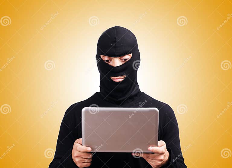 Hacker with Computer Wearing Balaclava Stock Photo - Image of computer ...