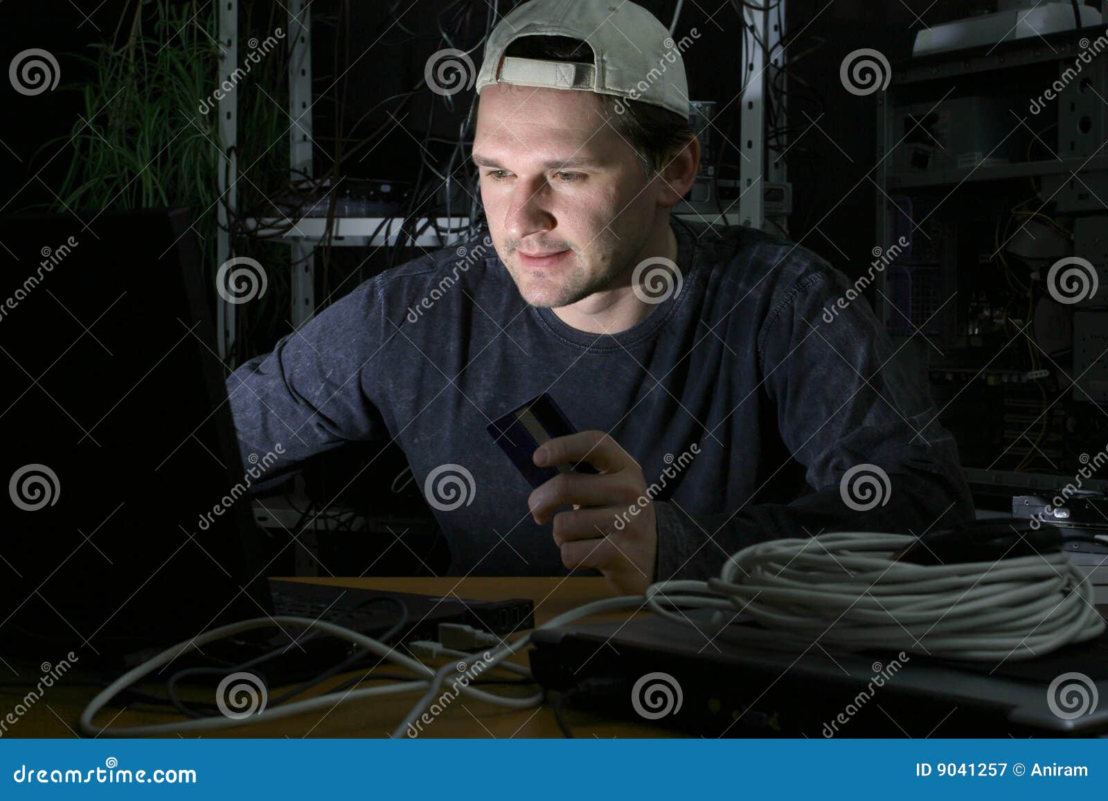 Hacker with credit card stock image. Image of internet - 9041257