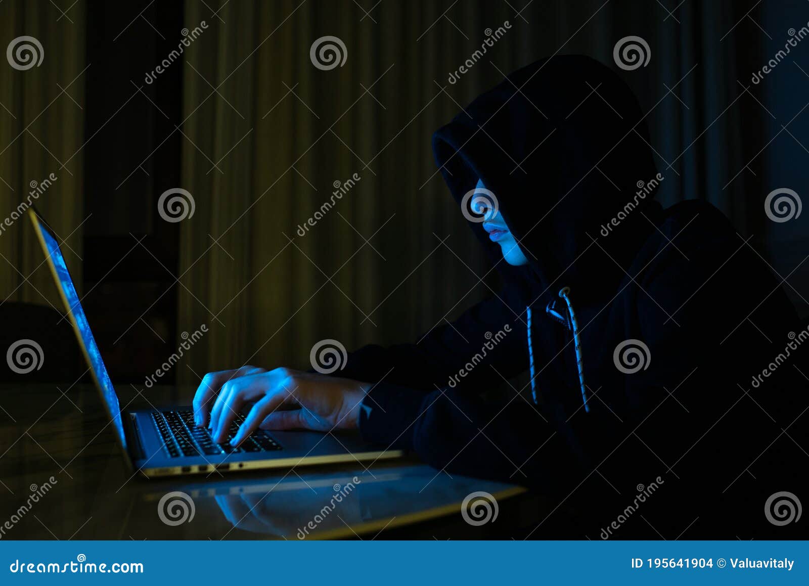 Hacker is Hacking into the Computer Network. Young Boy in a Dark Room ...