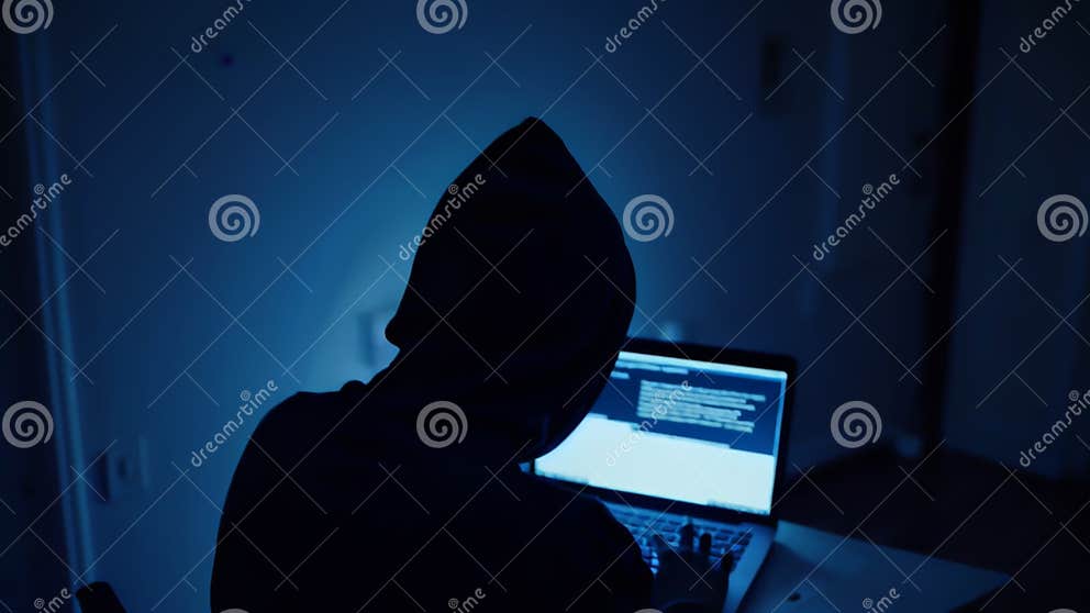 Hacker Hacks Programs. Computer Scammer. Programmers Working Intently on Laptop, Typing in Dark ...