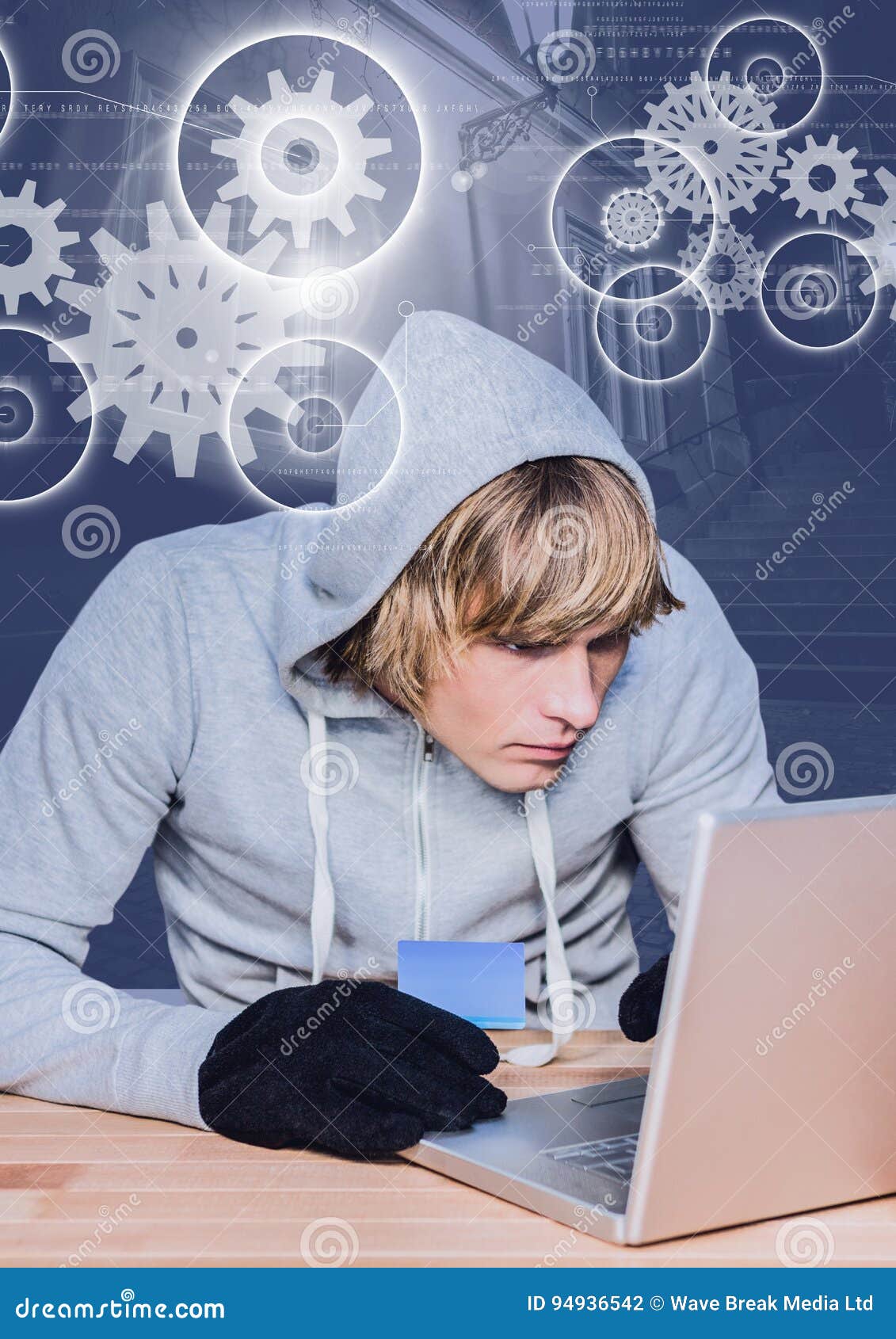 Hacker Holding a Credit Card while Using a Laptop on Wood Table Stock ...