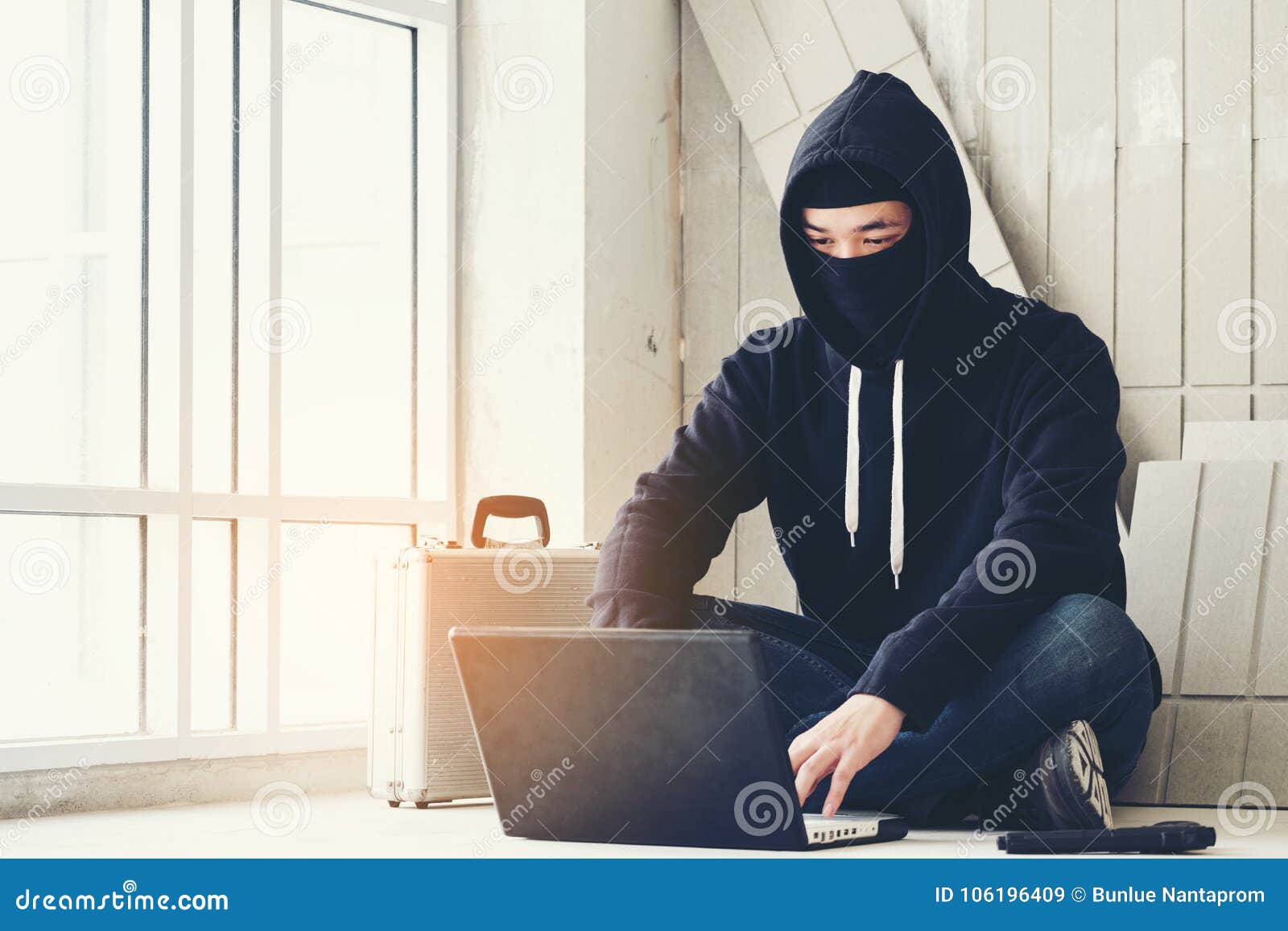 Hacker Holding Gun Working on His Computer, War, Terrorism , Terrorist ...