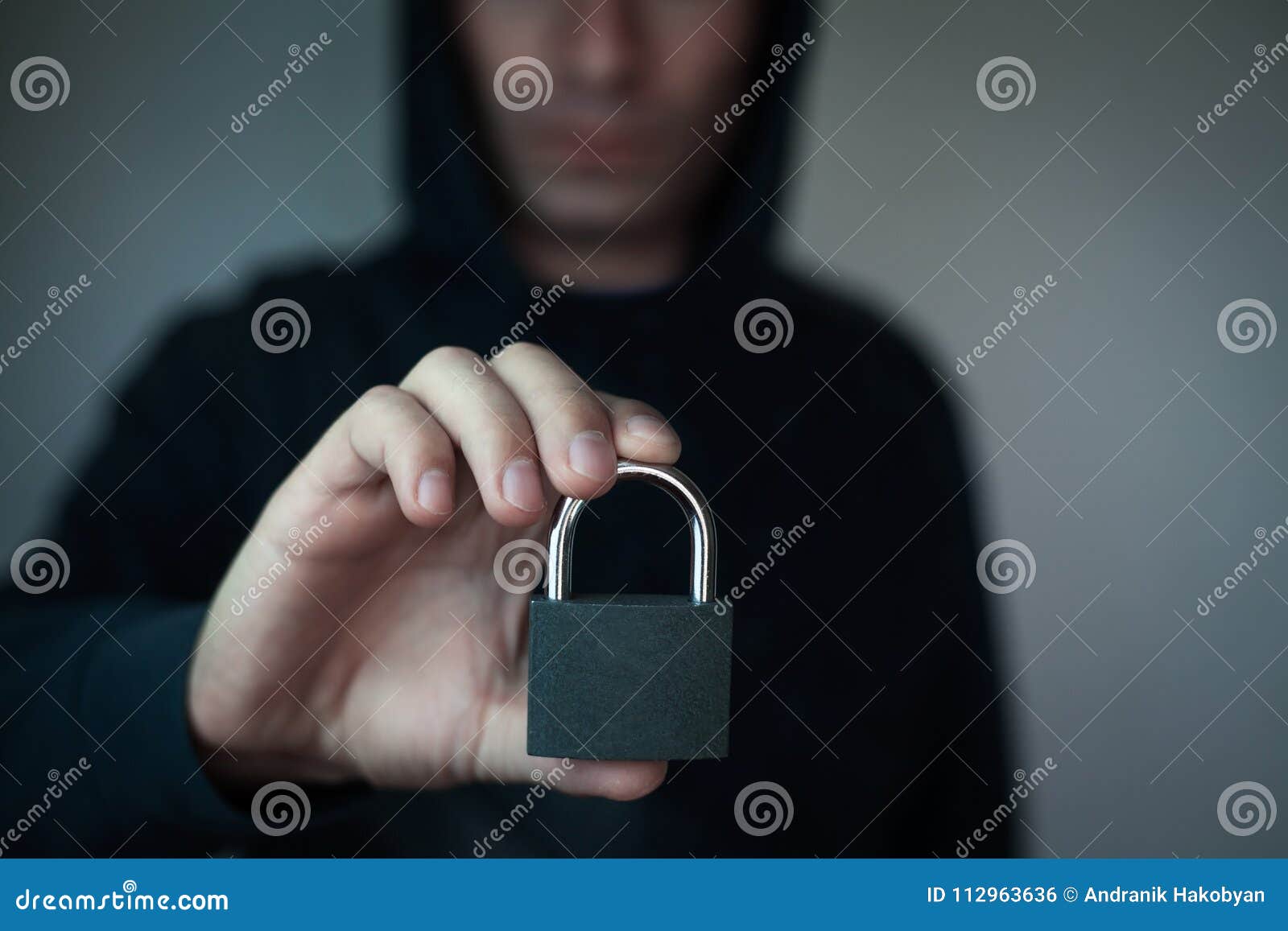 Hacker holding lock. stock photo. Image of symbol, padlock - 112963636
