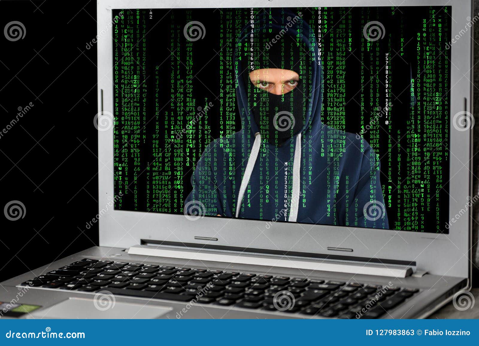 Hacker With Hood Isolated On Black Background With Binary Code In Front Of Him Stock Image