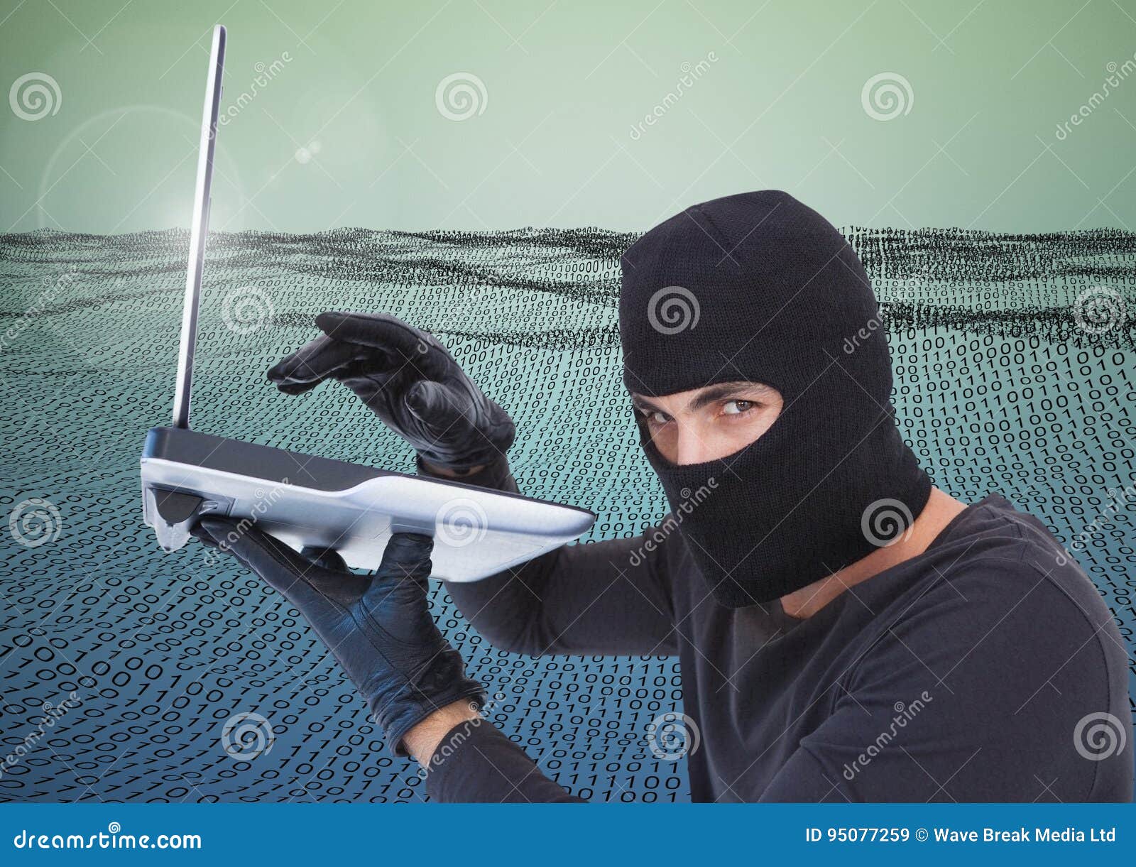 Hacker with Hood Using a Laptop in Front of Digital Number Field Stock ...