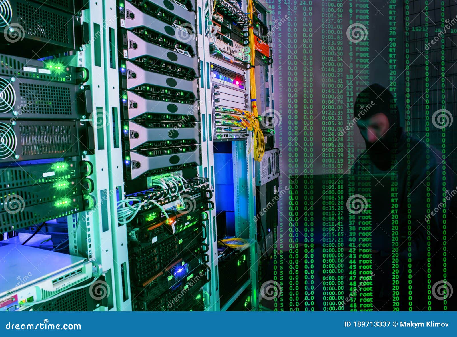 A Hacker with a Laptop on Her Lap Sitting in a Chair in Datacenter ...