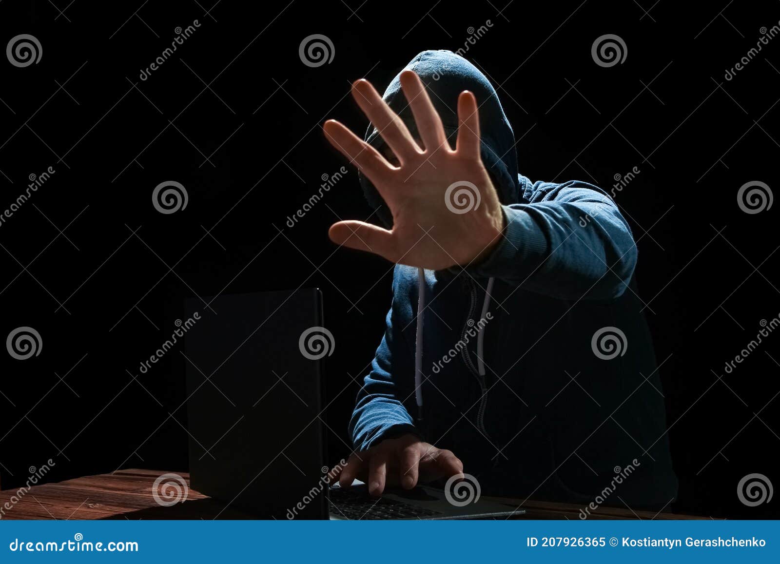 A Hacker with Laptop Sits at a Table and Abstract Binary Code. Business ...