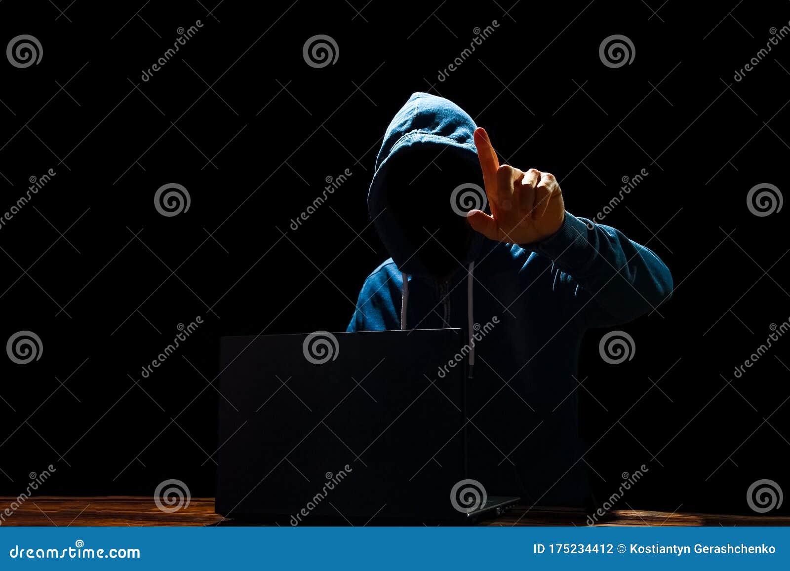 Hacker with Laptop at the Table Breaks into the System Stock Photo ...