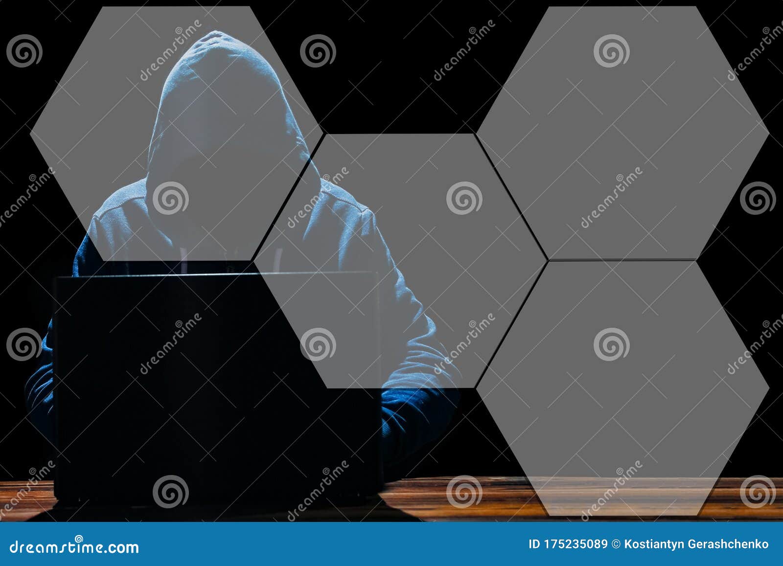 Hacker with Laptop at the Table Breaks into the System Stock Image ...