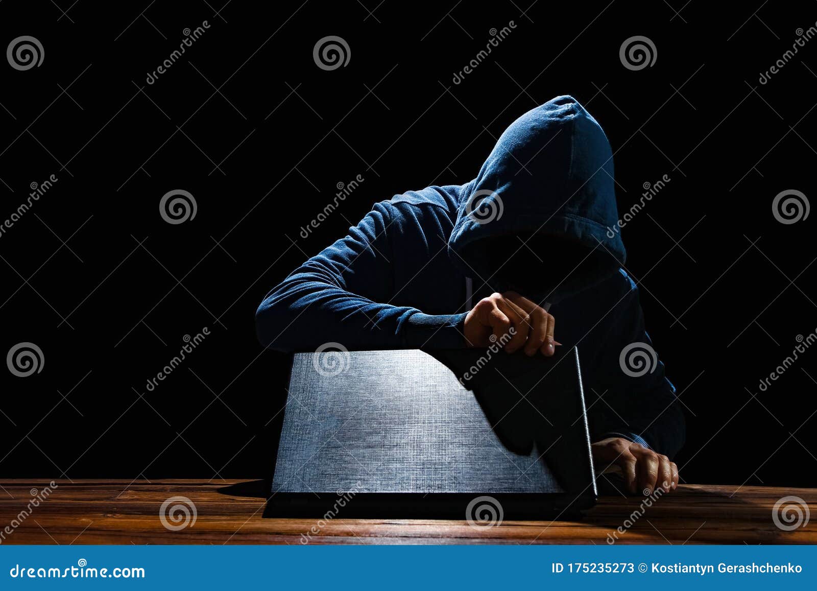 Hacker with Laptop at the Table Breaks into the System Stock Image ...