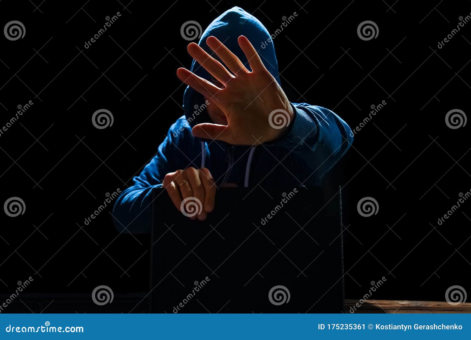 Hacker with Laptop at the Table Breaks into the System Stock Image ...