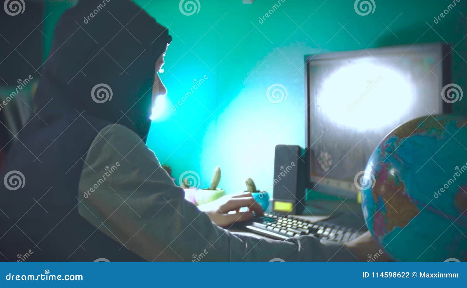 Hacker Man Programmer in the Hood Using Computer Laptop for Hack Information and Data from User ...