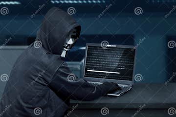 Hacker Man Wearing Mask Using Laptop To Upload Computer Virus Editorial ...