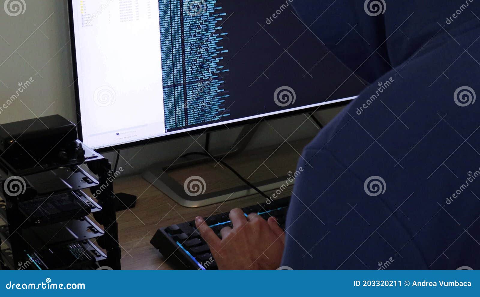 A Hacker Man Writes the Blue Code for an Attack. Program a Virus with ...