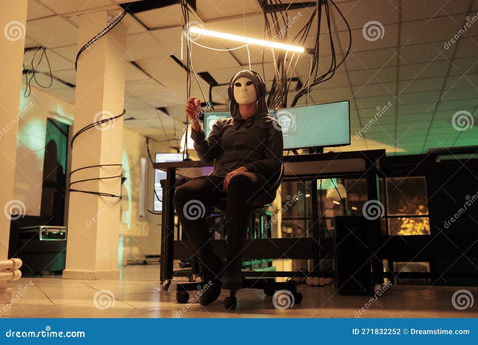Hacker with Mask Looking at Holographic Image in Augmented Reality ...