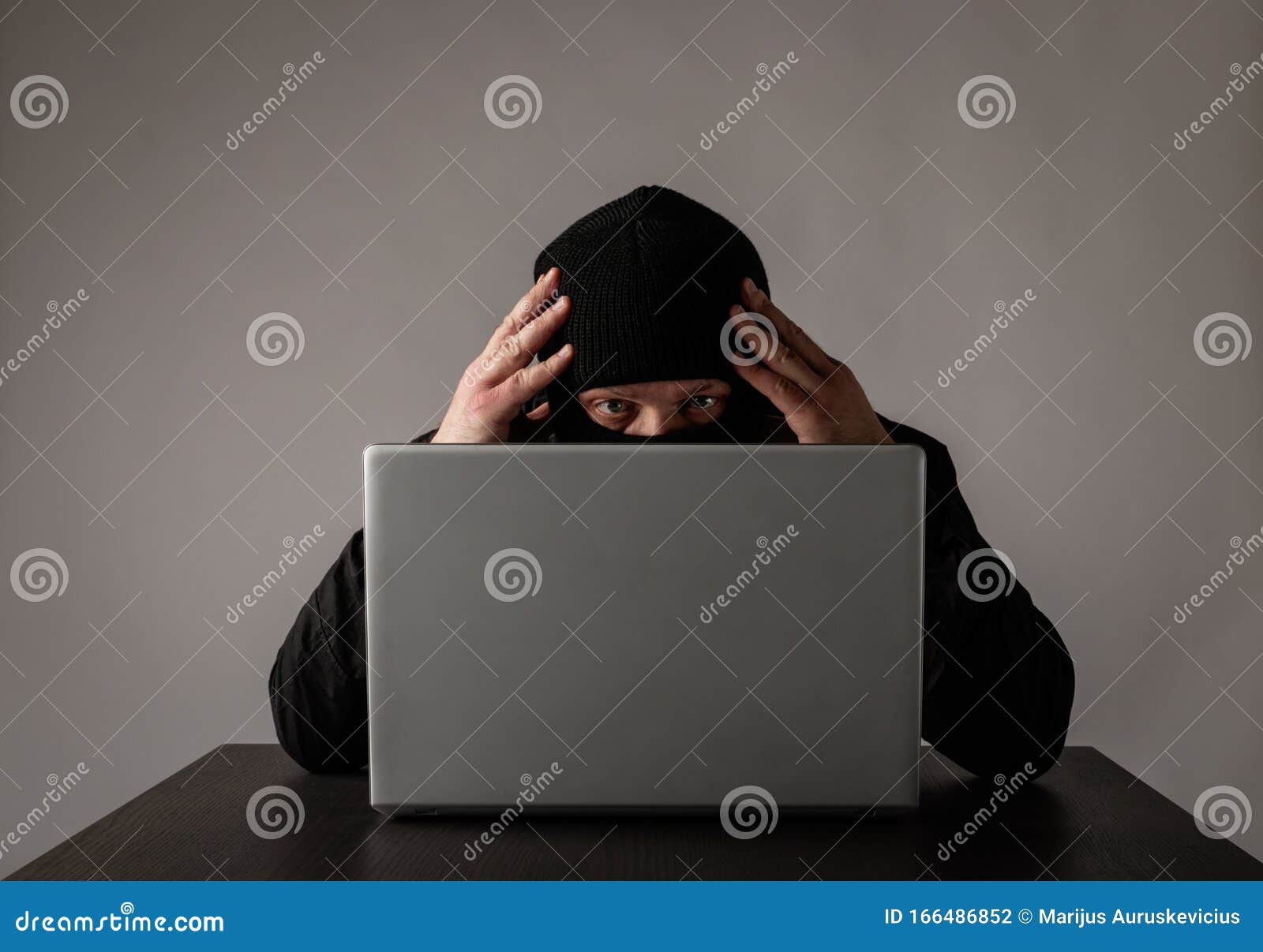 Hacker in Mask Using a Laptop Stock Photo - Image of programmer ...