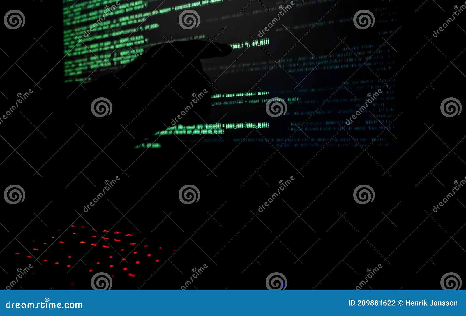 Hacker Pointing To Code On A Computer Monitor In A Dark Room Stock ...