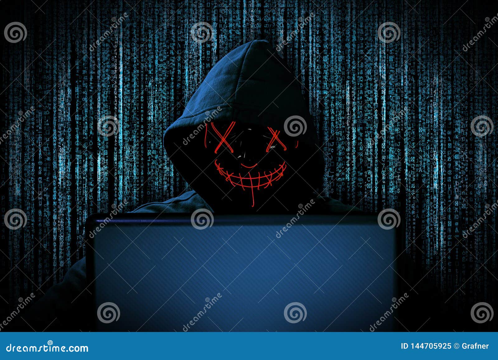 Hacker with Red Glowing Mask Behind Notebook Laptop in Front of Blue Source Binary Code ...