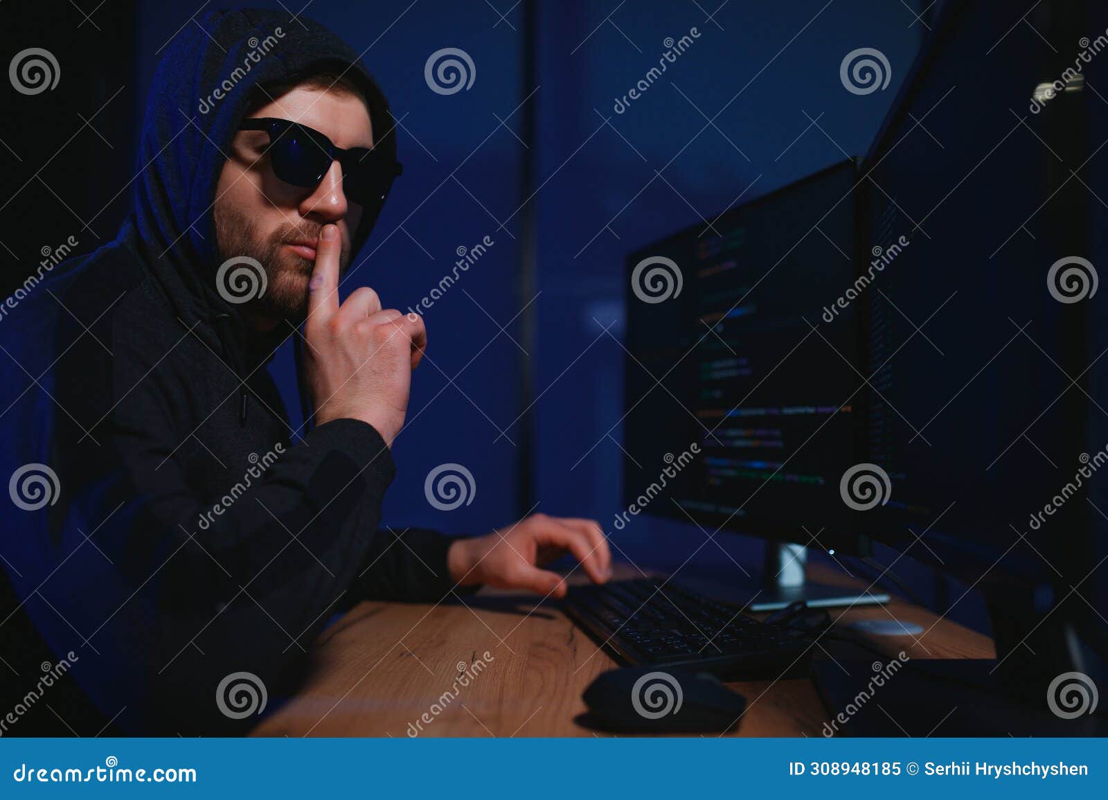 Hacker Sitting at Desk in Dark Atmosphere. a Computer Programmer or ...
