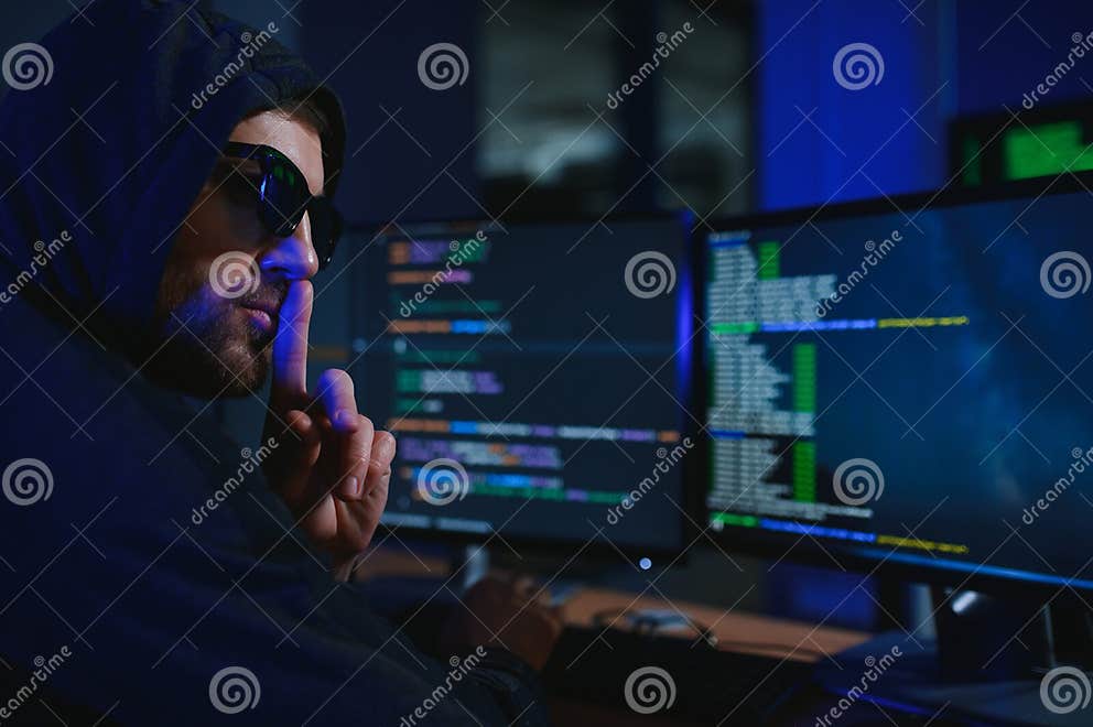 Hacker Sitting At Desk In Dark Atmosphere A Computer Programmer Or Hacker Anonymous Computer