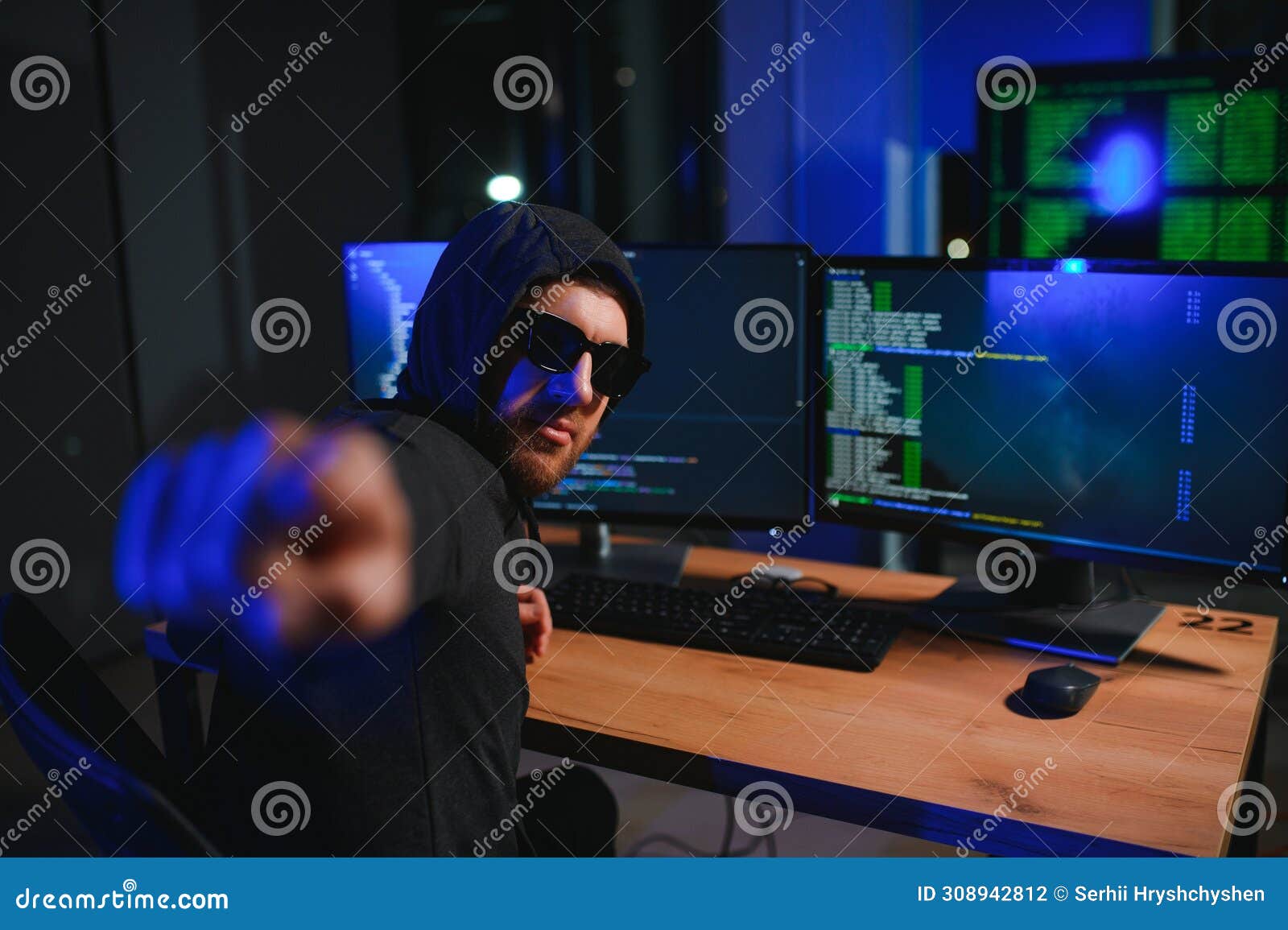 Hacker Sitting At Desk In Dark Atmosphere A Computer Programmer Or Hacker Anonymous Computer