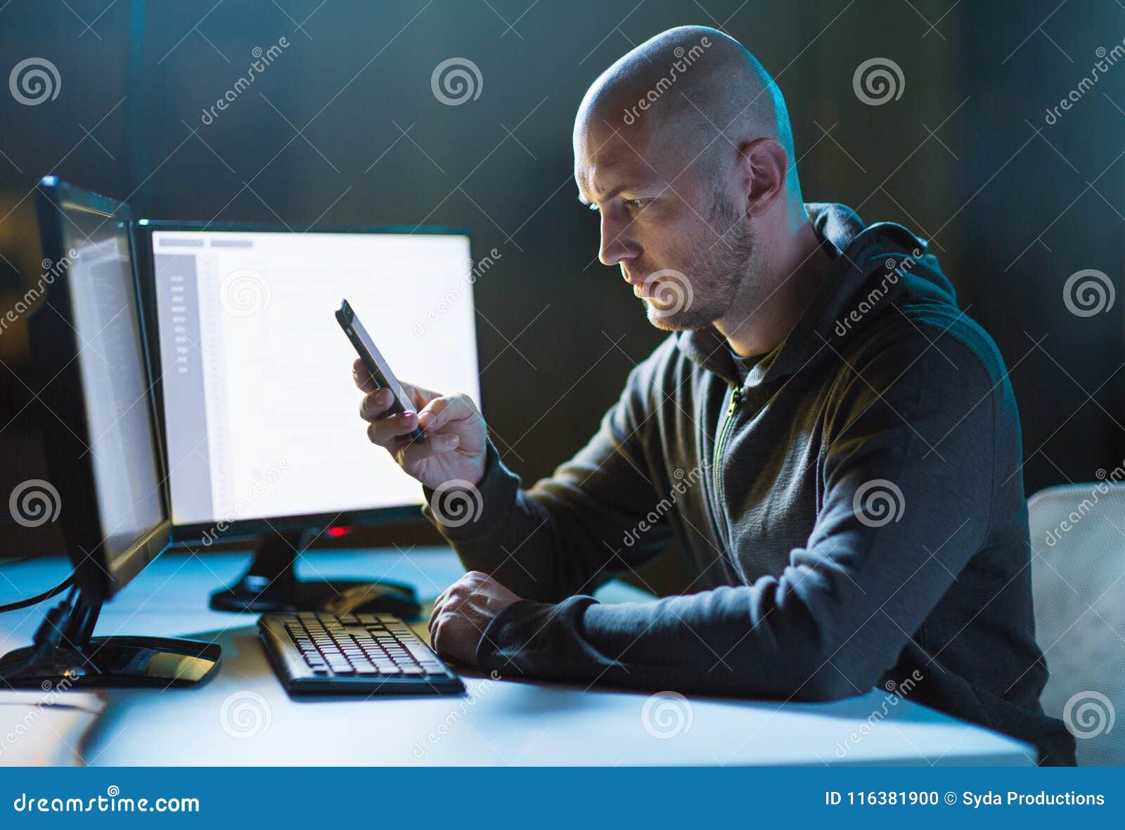 Hacker with Smartphone and Computers in Dark Room Stock Photo - Image ...
