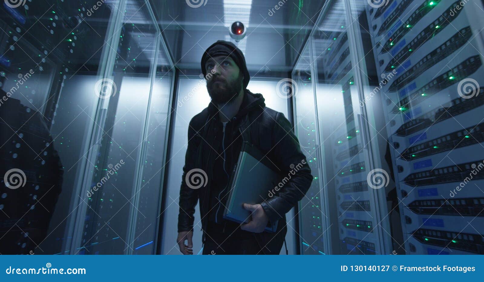 Hacker Sneaking through Rows of Servers with Laptop Stock Image - Image ...