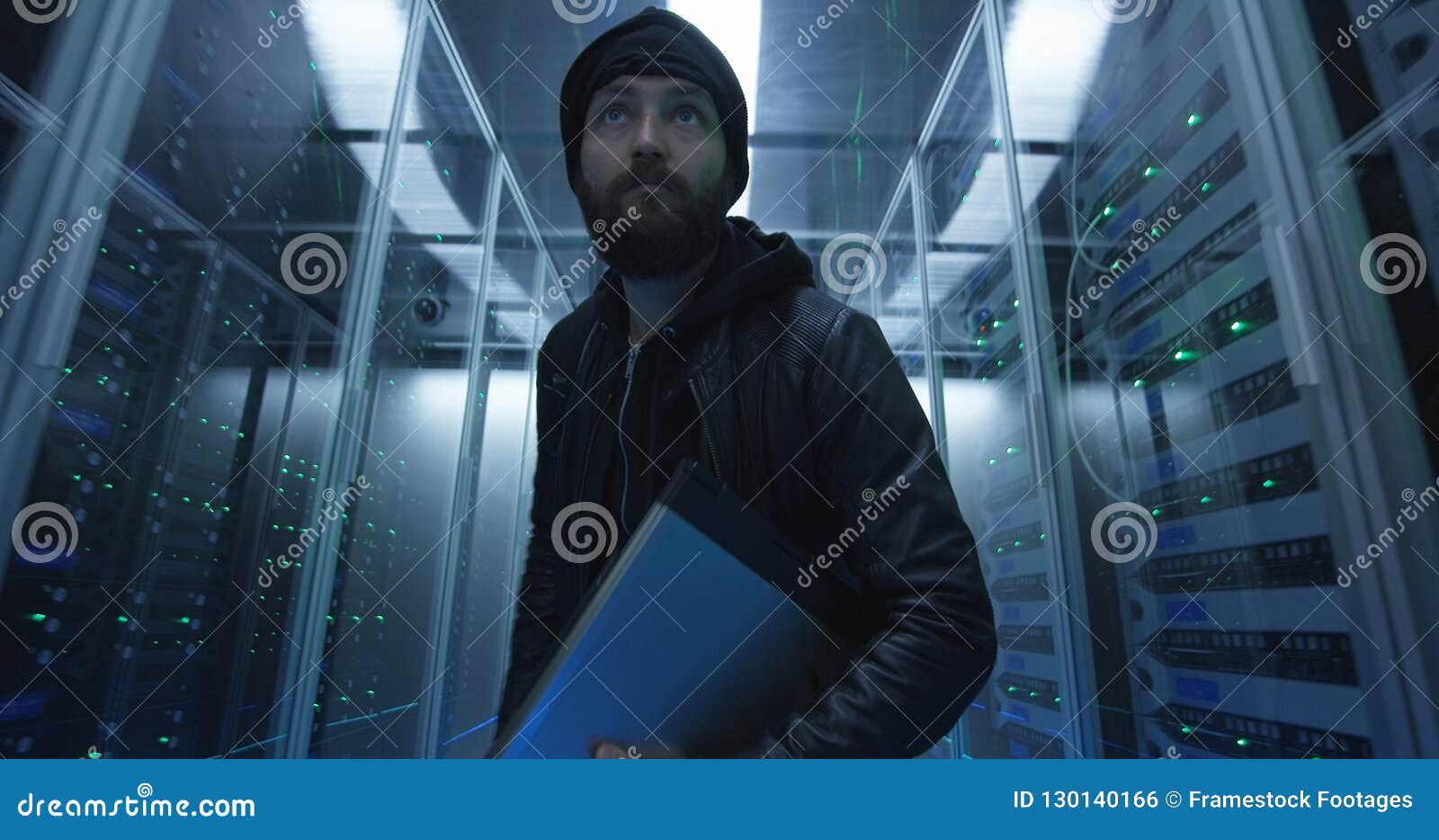 Hacker Sneaking through Rows of Servers with Laptop Stock Photo - Image ...
