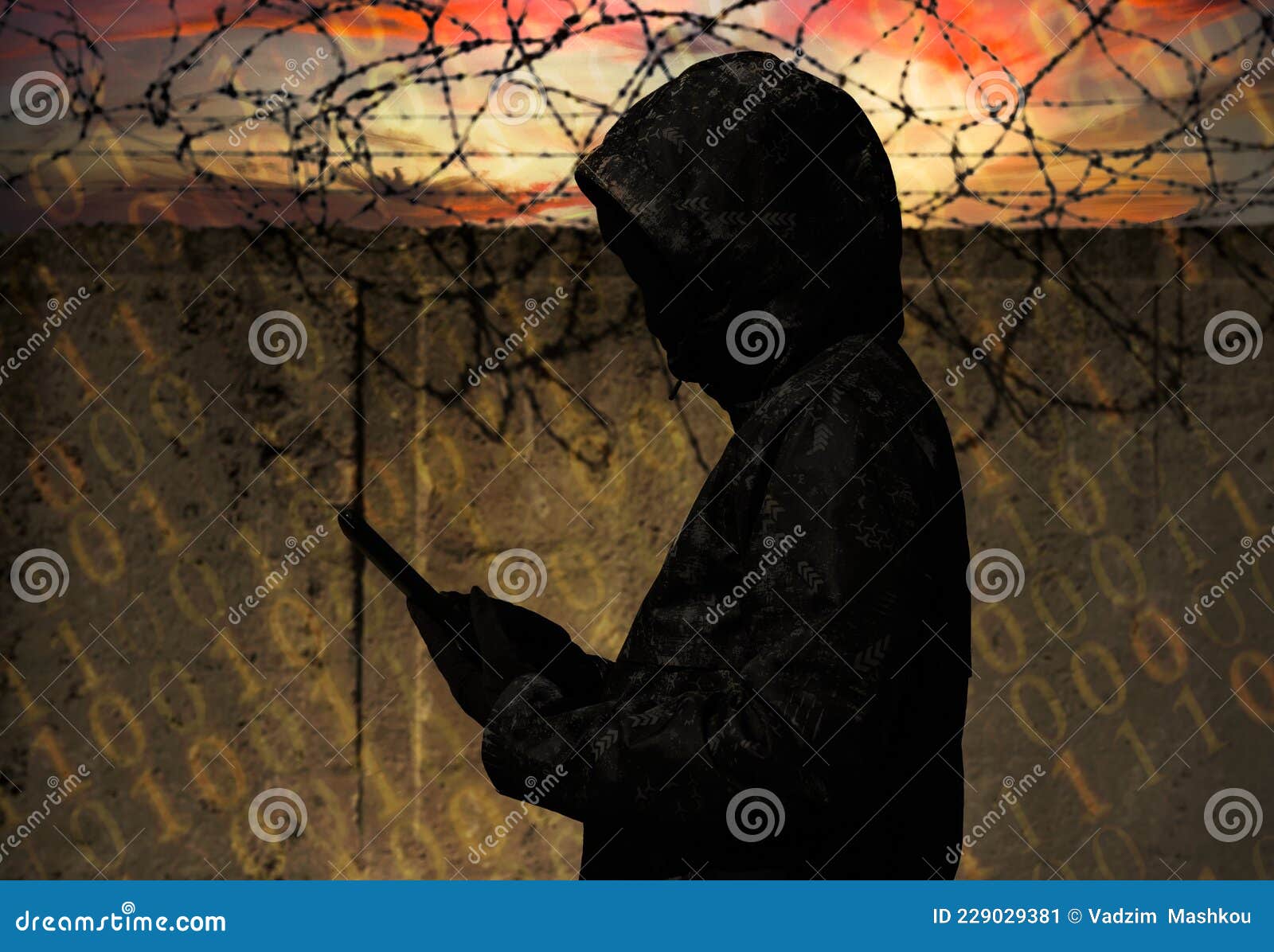 A Hacker Stands Against the Wall of a Prison with Barbed Wire ...