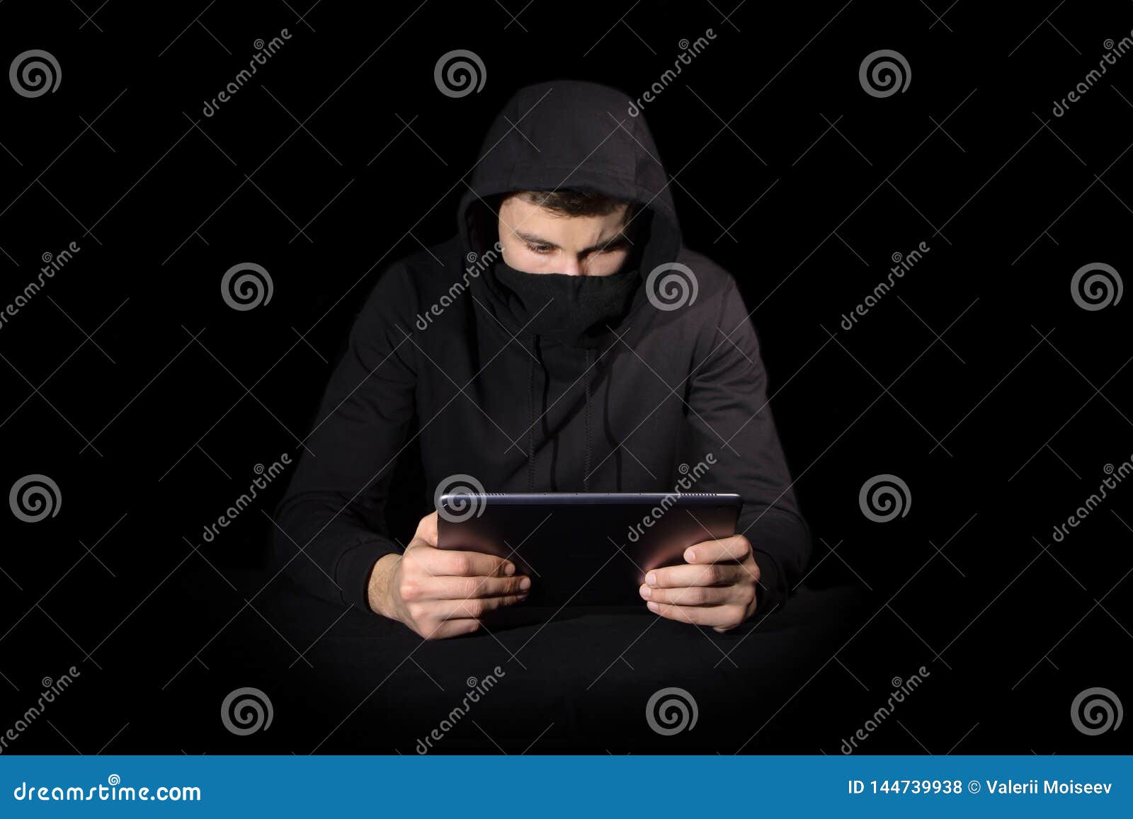 Hacker with Tablet PC Initiating Cyber Attack, on Black Stock Photo ...
