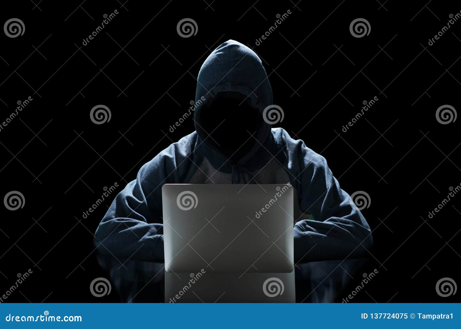 Hacker Typing On A Laptop Isolated On Black Background With A Computer