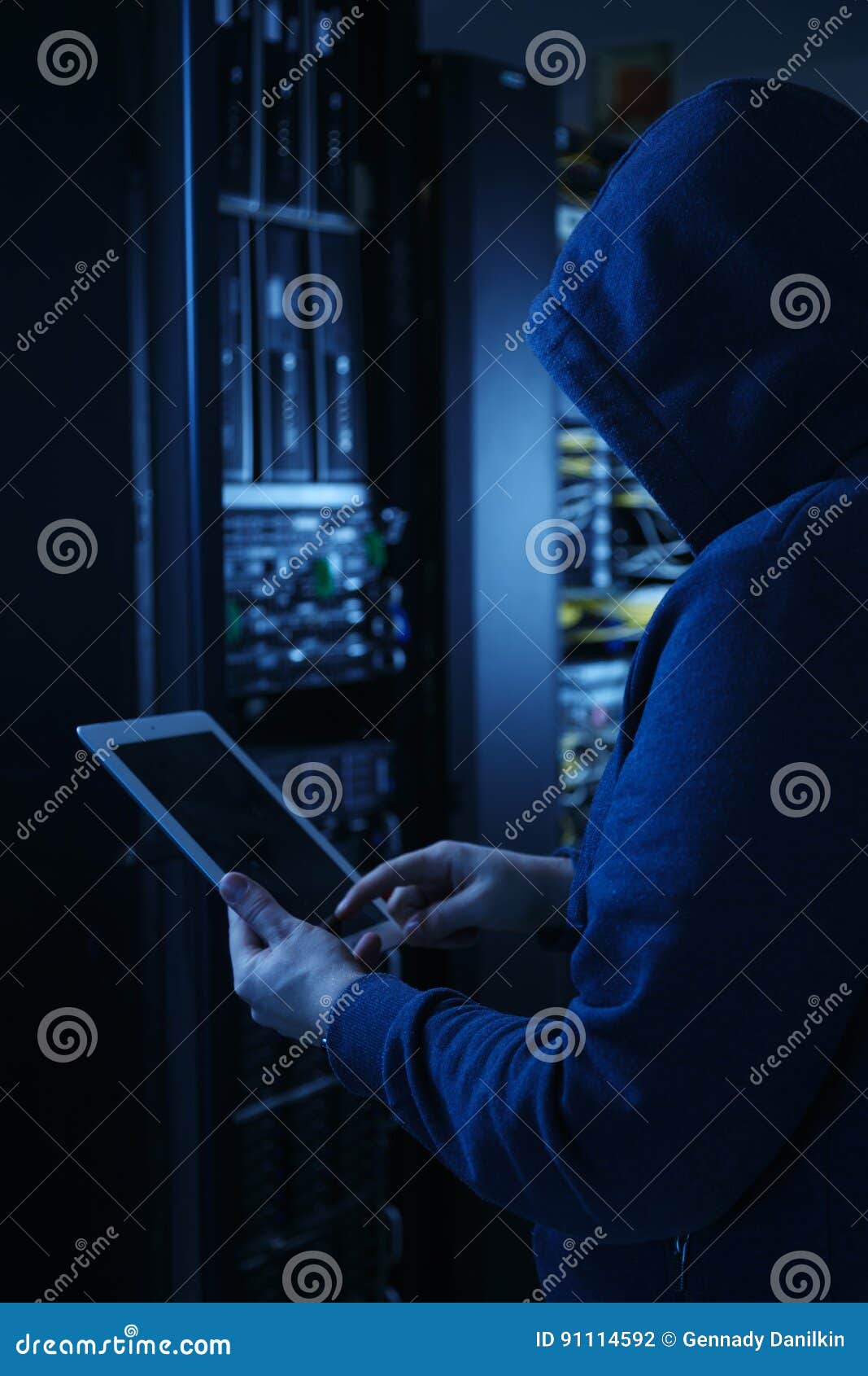 The Hacker Uses a Tablet Computer To Steal Information. Stock Photo ...